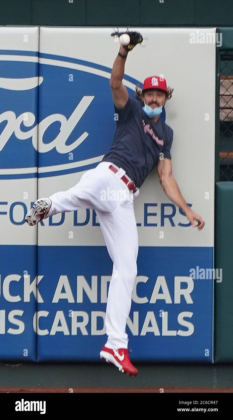 St. Louis Cardinals pitcher Andrew Miller makes a jumping catch on a ...