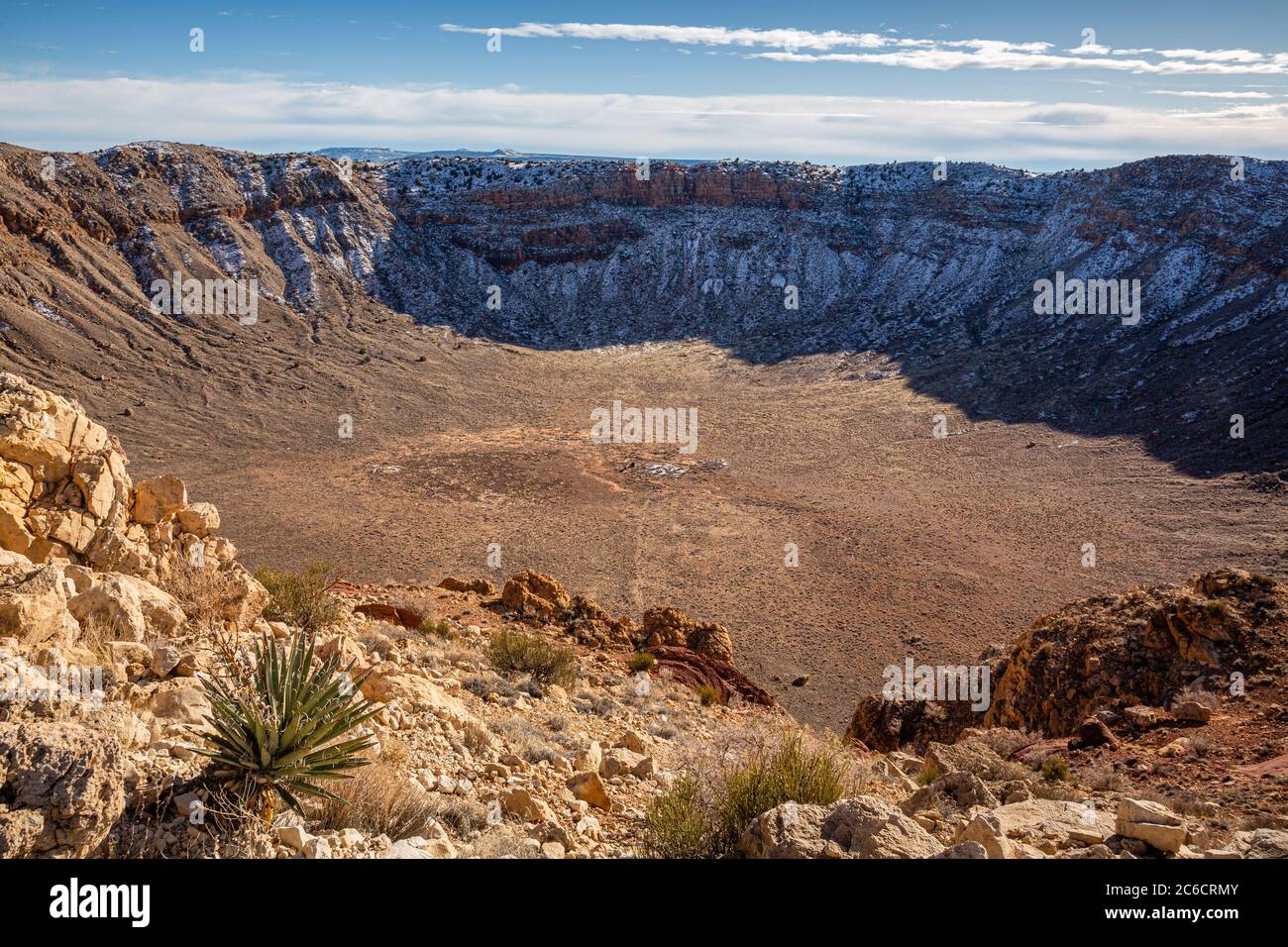 A Winter view of the Barringer Meteor Crater with snow in the shadows ...