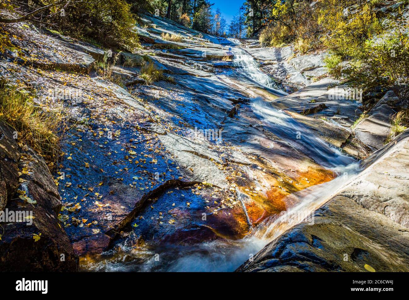 Water cascades over a steep granite slope in Ash Creek Canyon, Mt ...