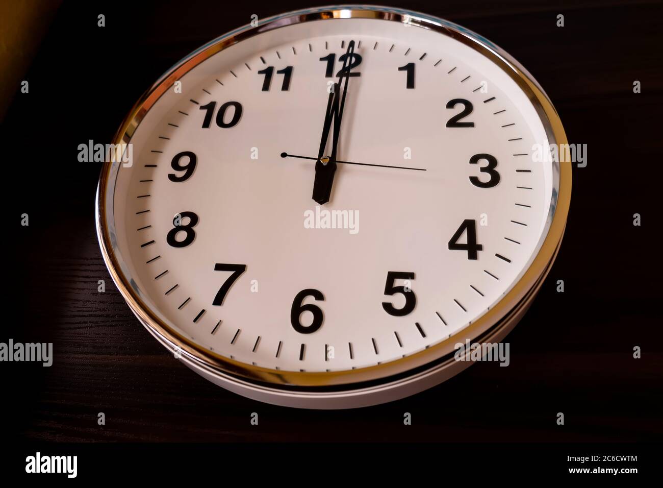 a top view of round white wall clock isolated on wooden table Stock ...