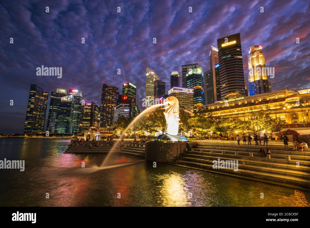 The Merlion Fountain and downtown skyline at night, Singapore, Republic ...