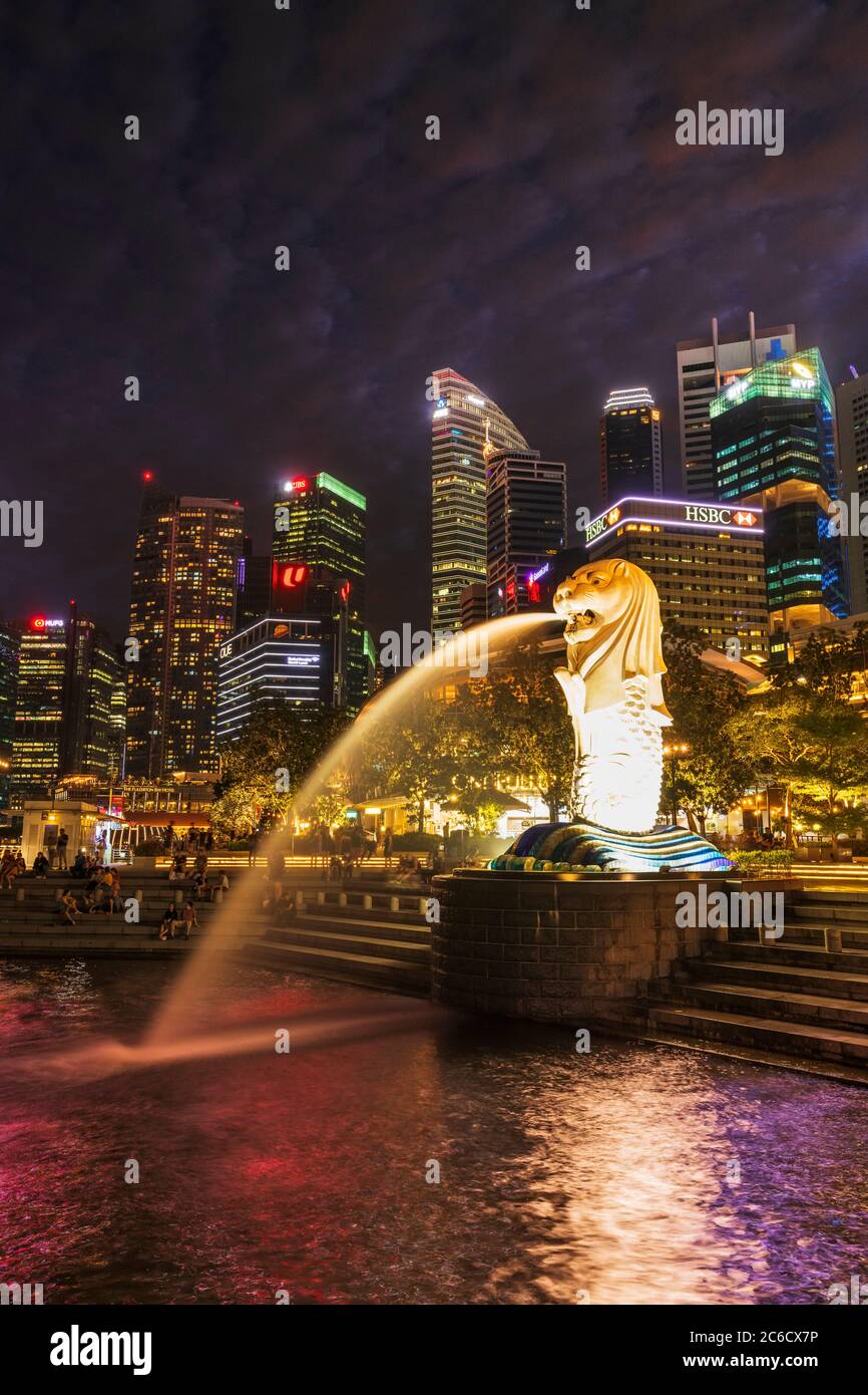 The Merlion Fountain and downtown skyline at night, Singapore, Republic ...