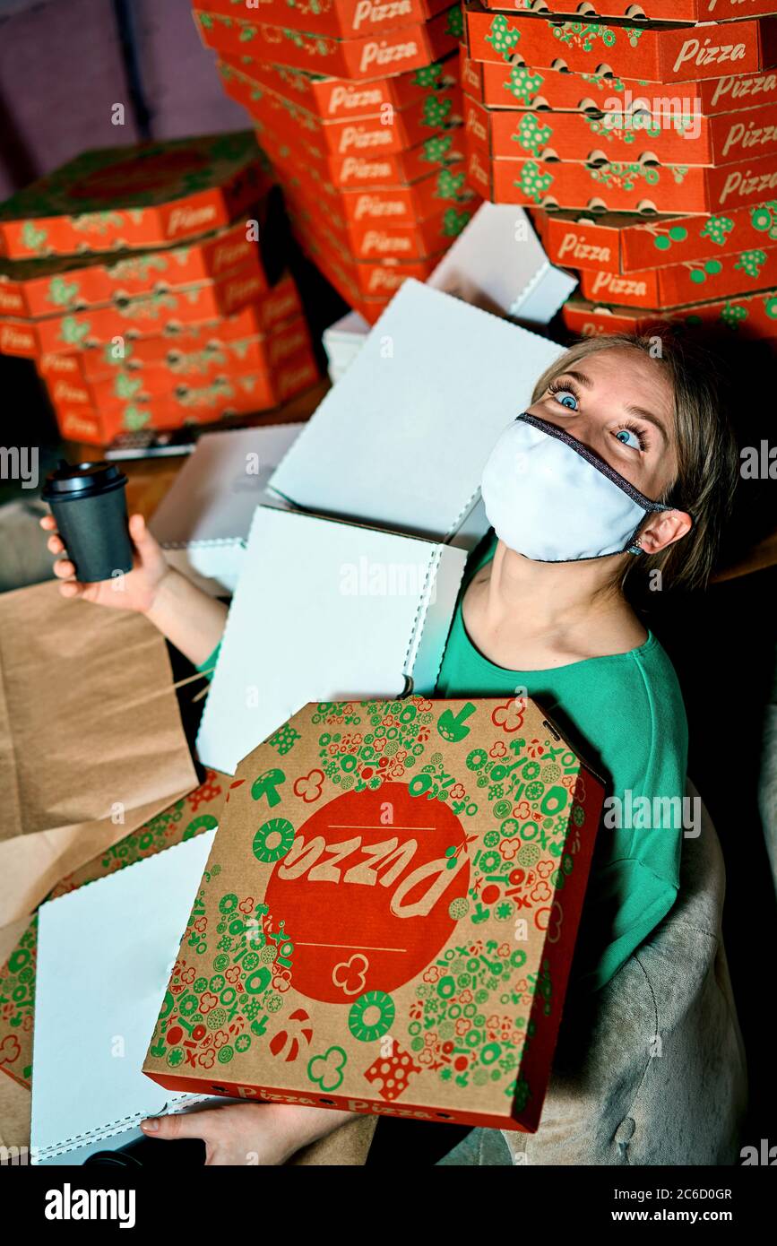 the food delivery girl is covered in boxes Stock Photo - Alamy