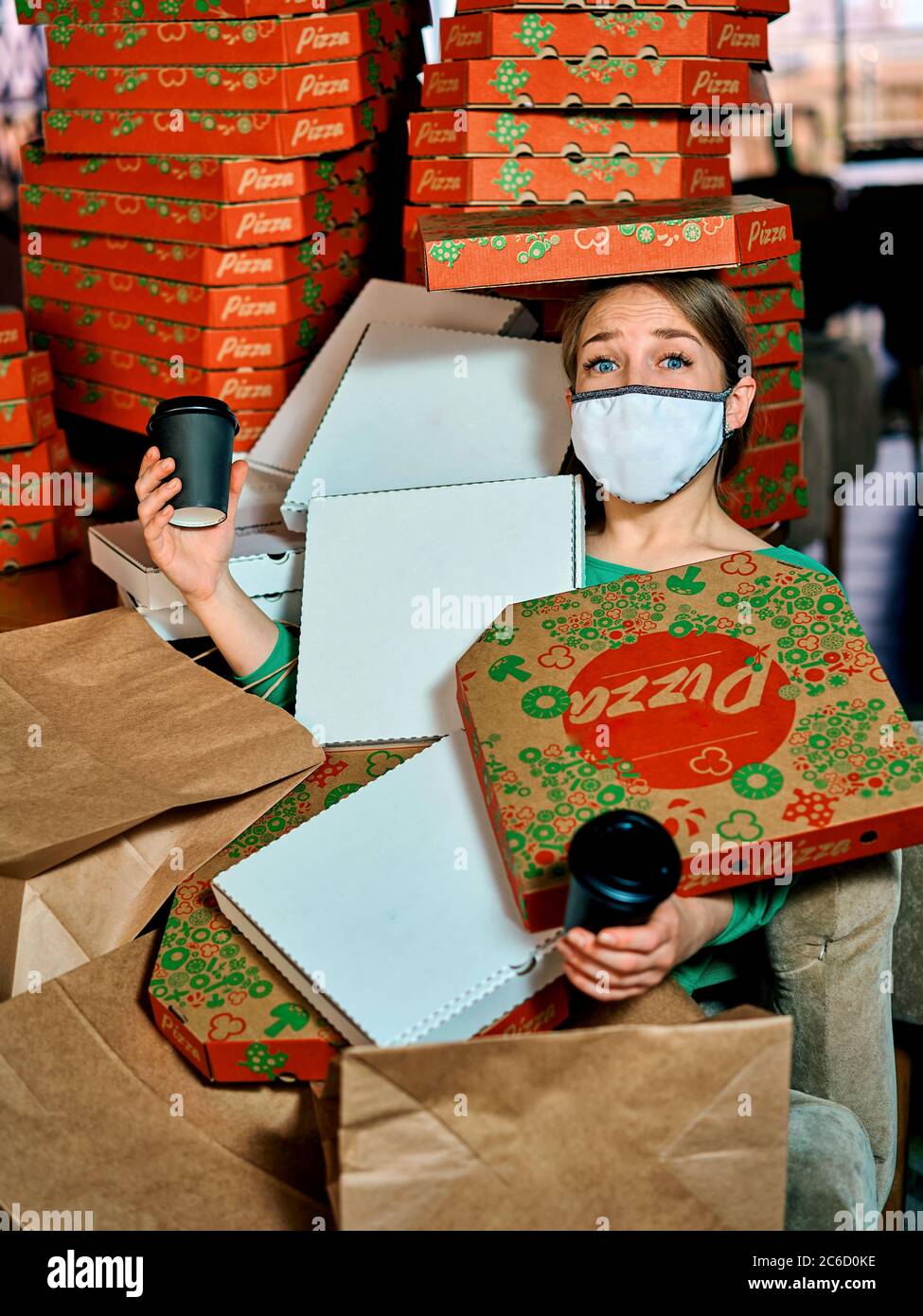the food delivery girl is covered in boxes Stock Photo - Alamy