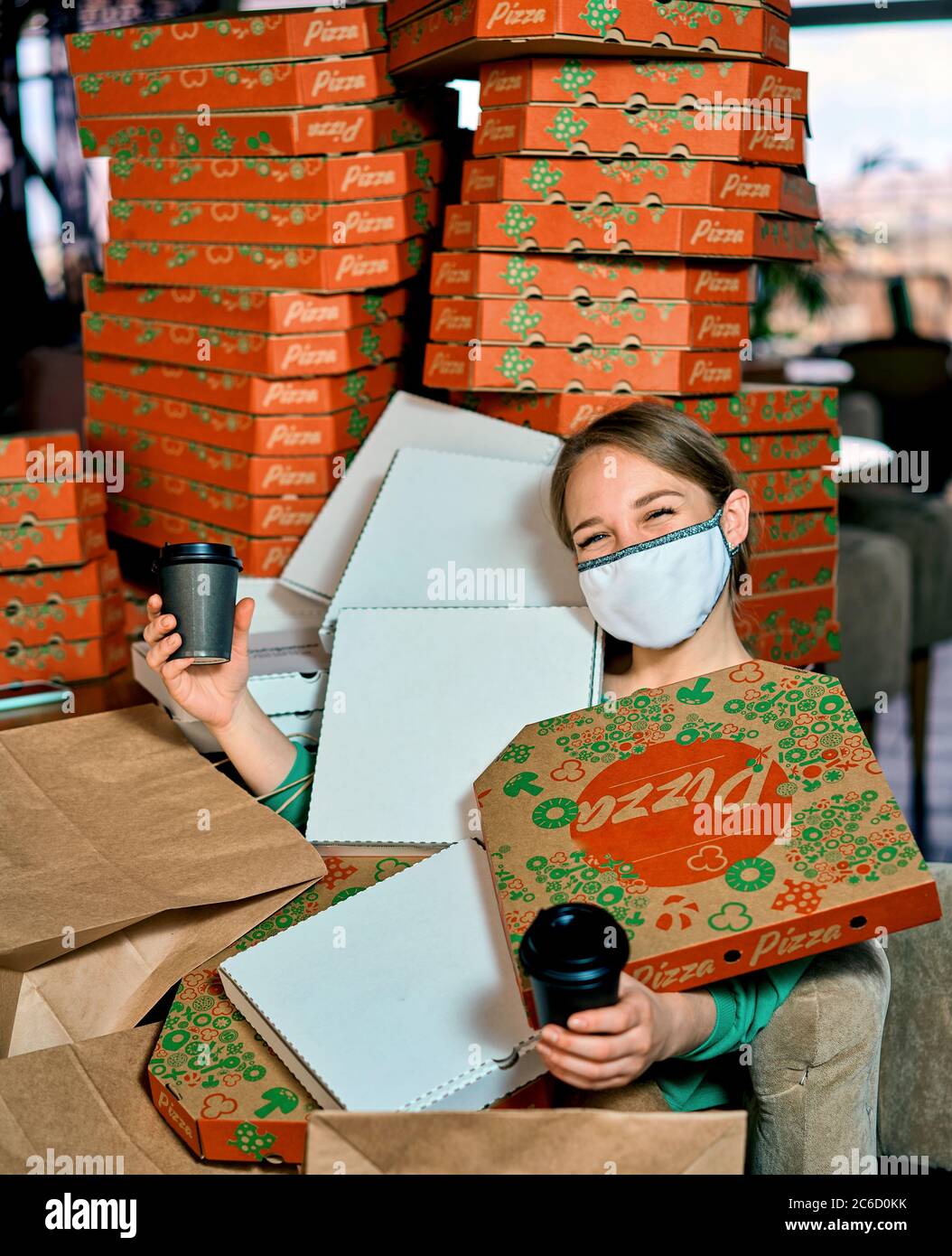 the food delivery girl is covered in boxes Stock Photo - Alamy