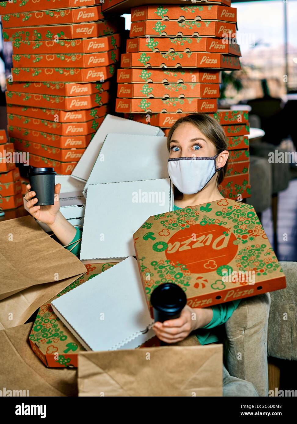the food delivery girl is covered in boxes Stock Photo - Alamy
