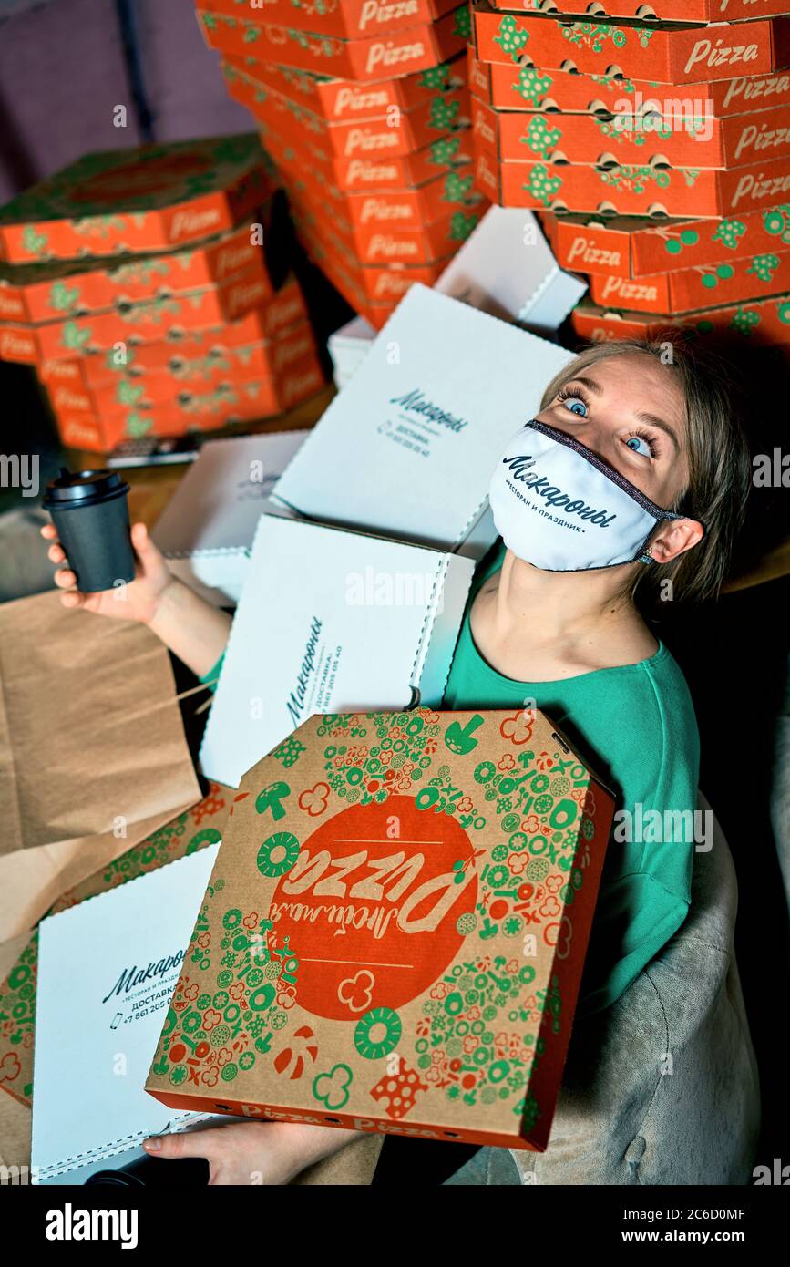 the food delivery girl is covered in boxes Stock Photo - Alamy