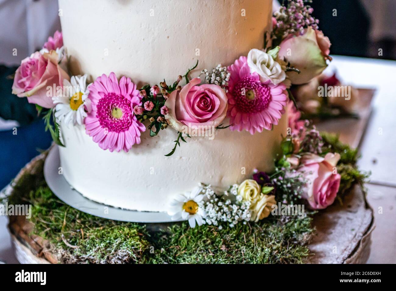 beautiful delicious Wedding cake in many tiers with fresh wild flowers ...