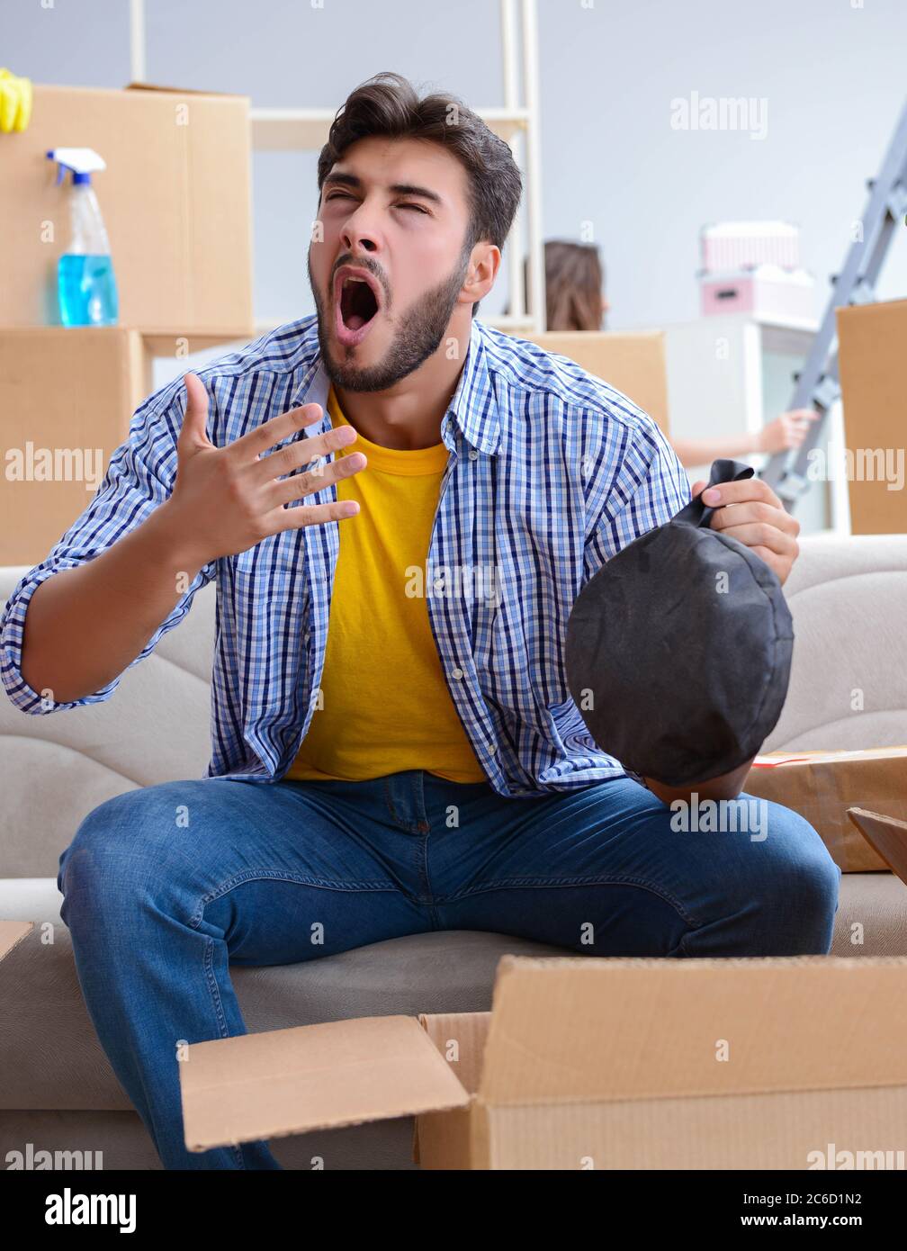 Woman packing boxes during move hi-res stock photography and images - Alamy