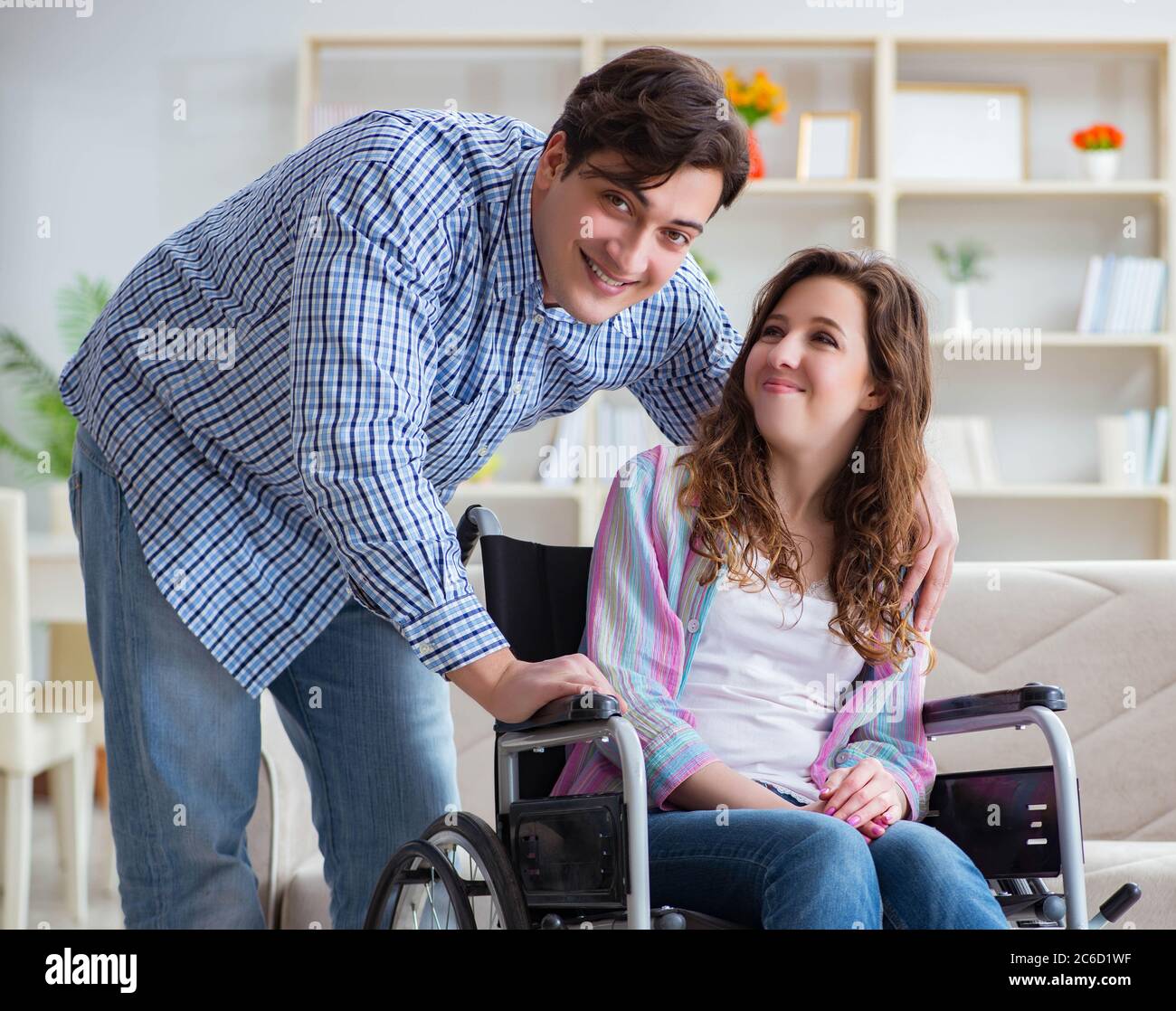 The young family taking care of each other Stock Photo - Alamy