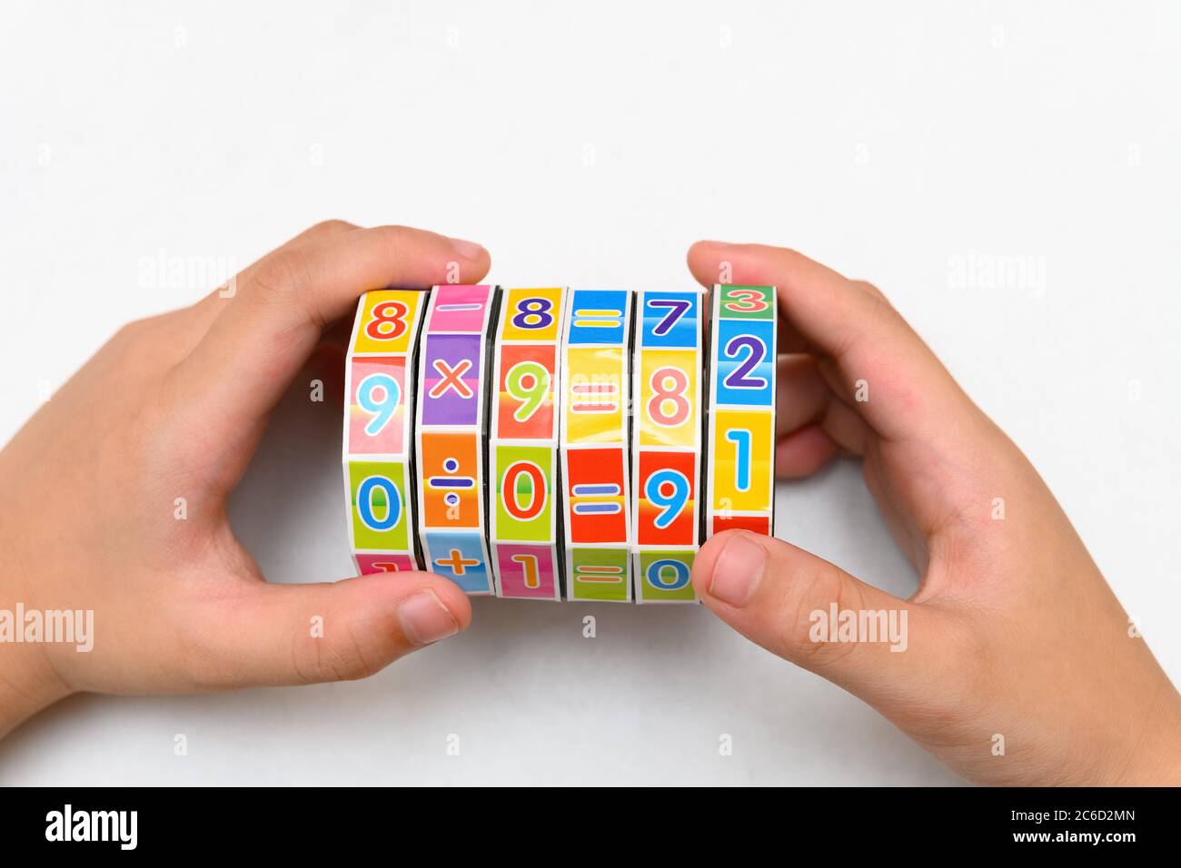 kid using mathematics block and doing equations Stock Photo - Alamy