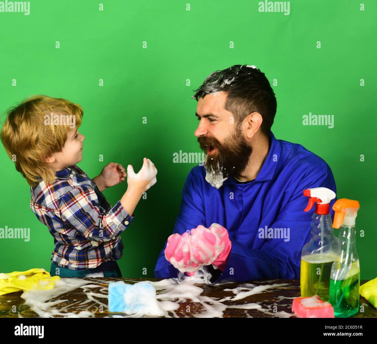 Father and kid having fun during cleaning. Dad with son and cleaning ...