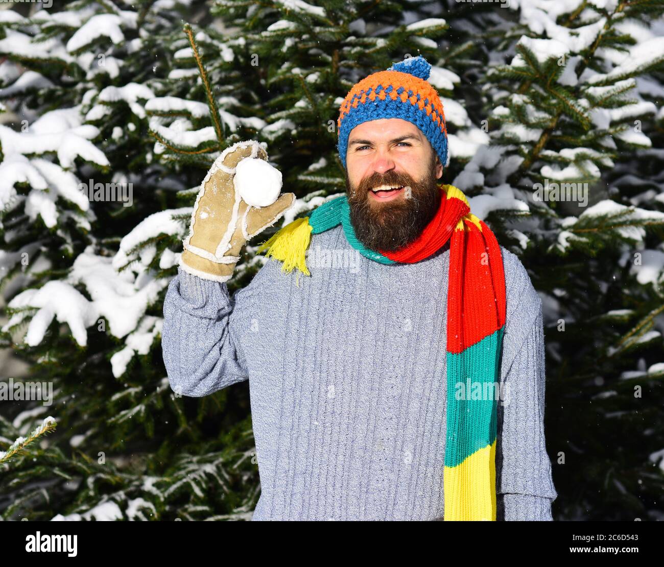 Man with knitted hat, scarf and glove. Outdoor entertainment concept ...