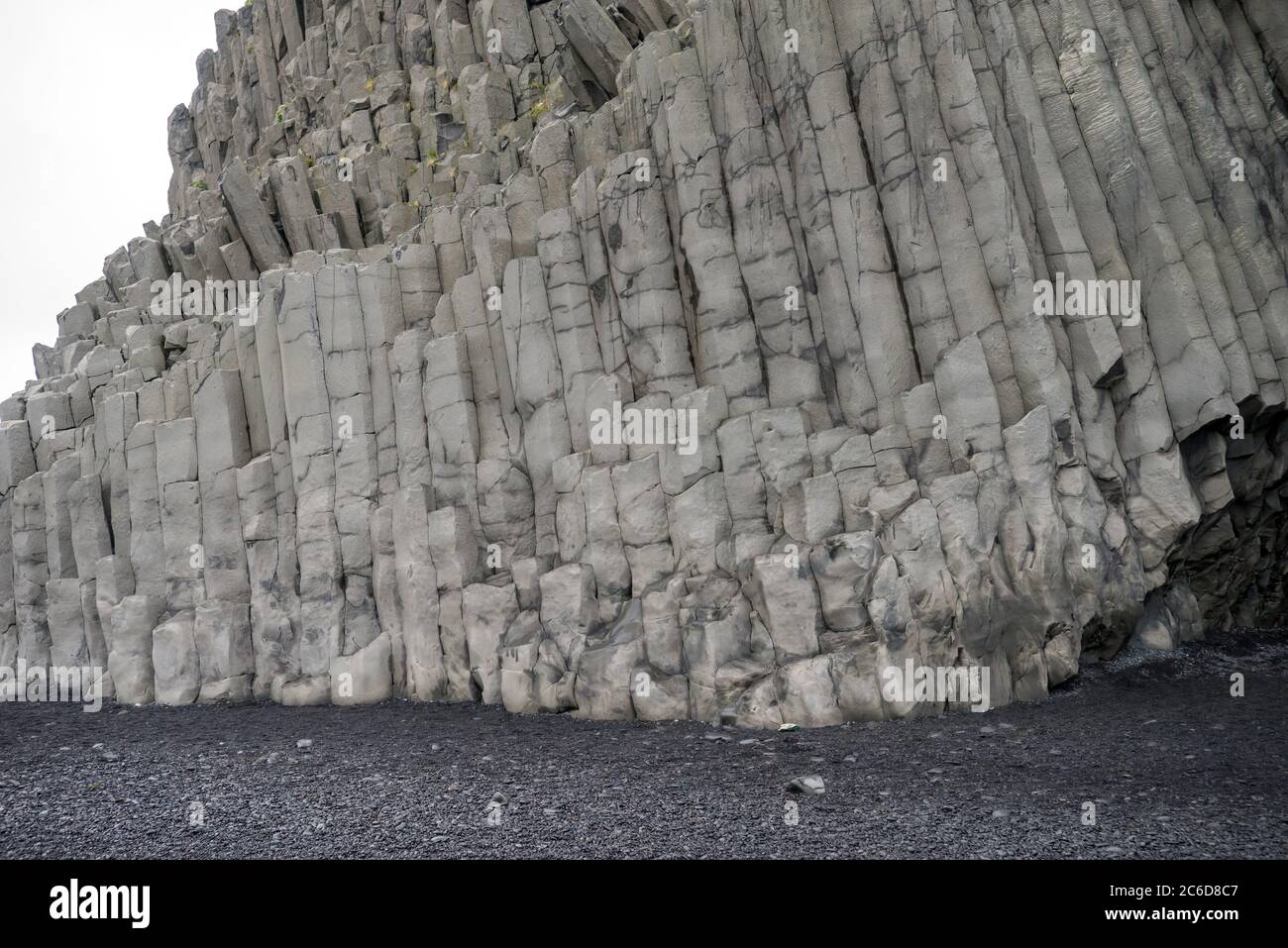 Column of basalt stone in the black sand beach of Reynisfjara in the ...