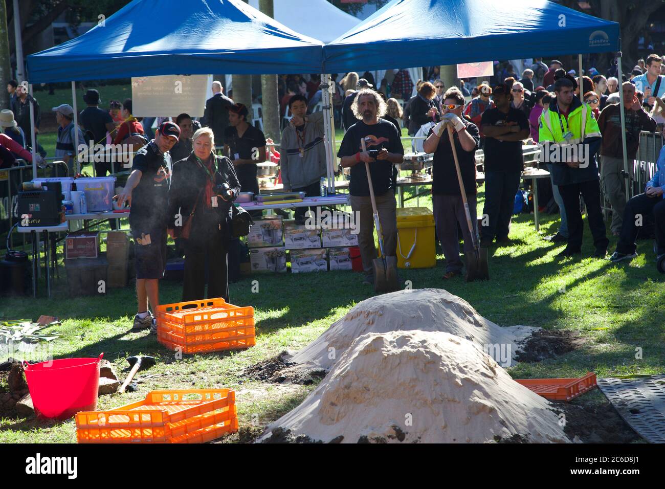 Earth ovens are used to cook in the traditional Aboriginal way at the ...