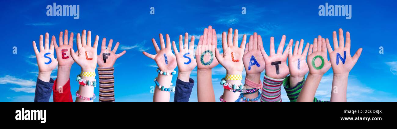 Kids Hands Holding Word Self Isolation, Blue Sky Stock Photo - Alamy