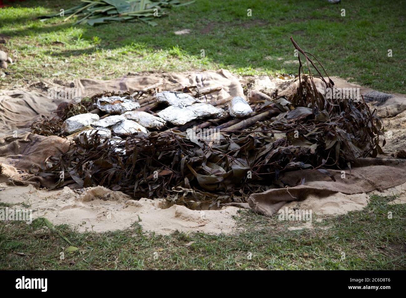 Food is cooked in the traditional Aboriginal way in an earth oven at ...
