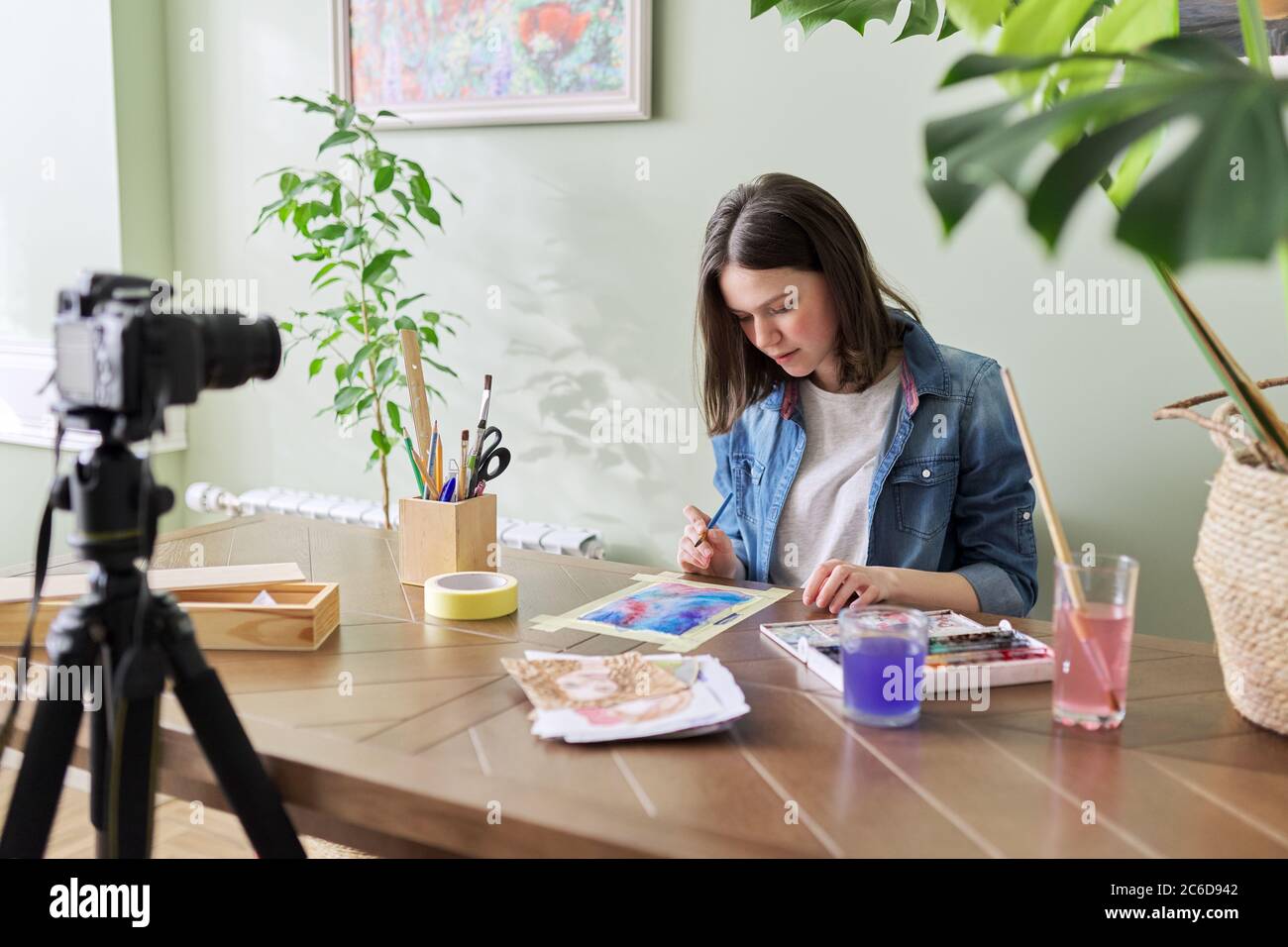 Creative girl teenager artist painting in watercolor Stock Photo - Alamy
