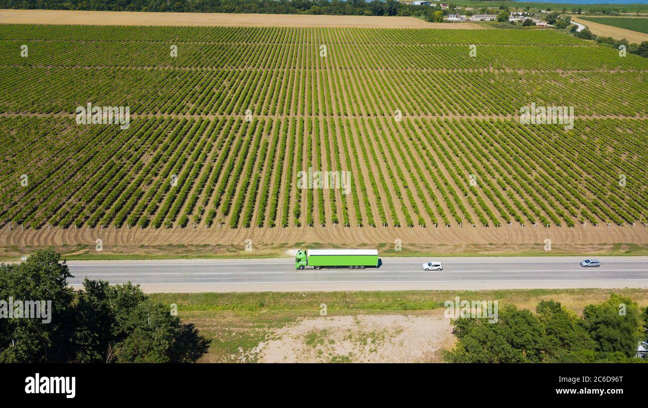 Aerial view of a country road in beautiful agricultural fields in ...