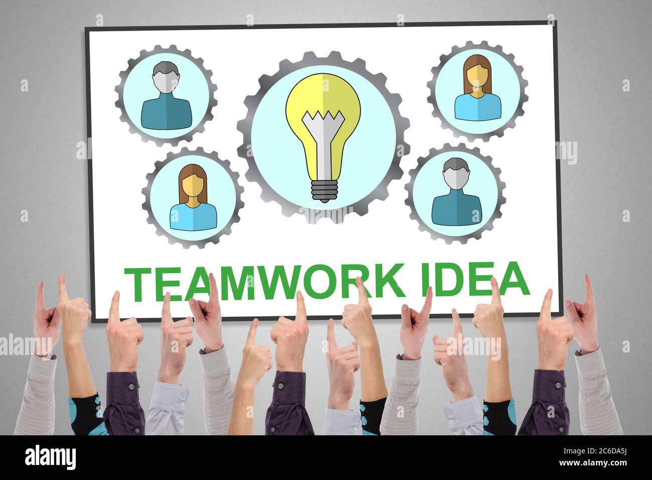 Teamwork idea concept on a whiteboard pointed by several fingers Stock ...