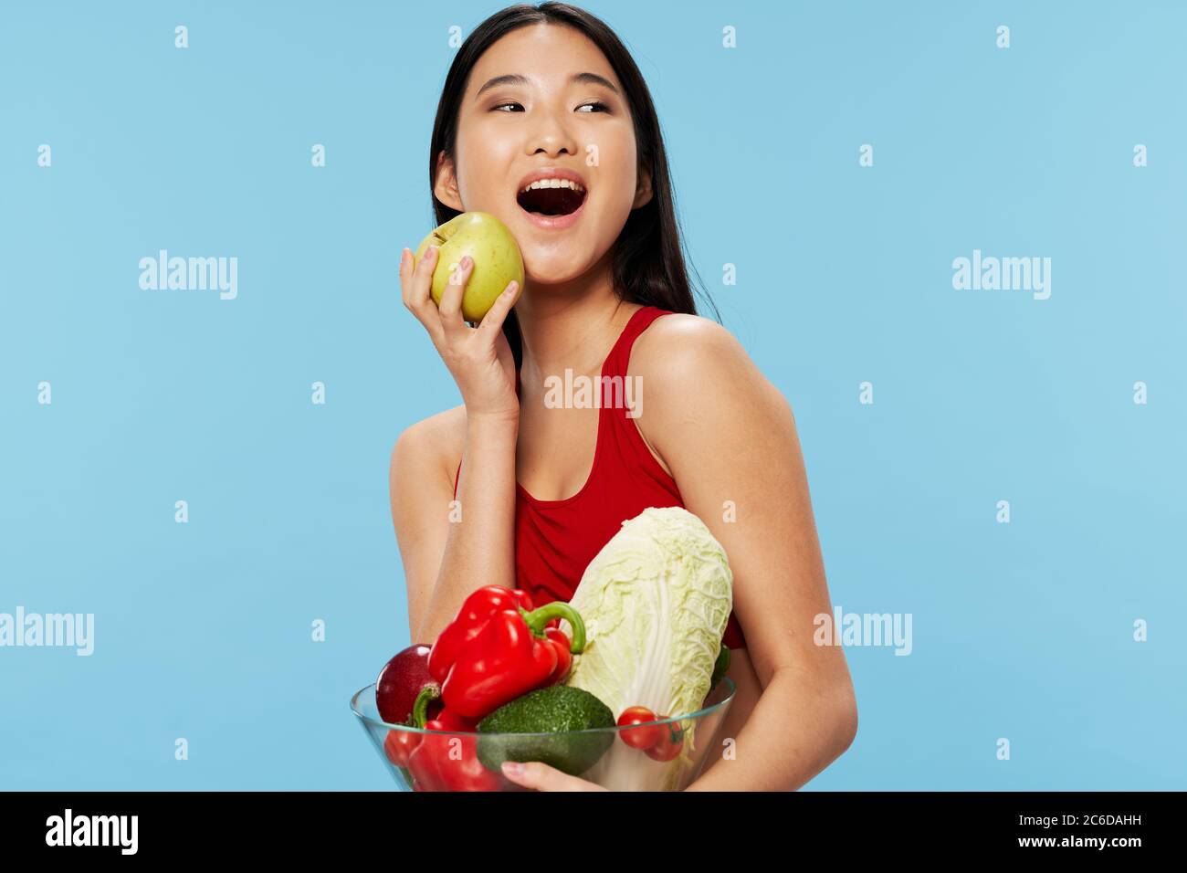 Happy dieting woman with groceries in hand smiling Stock Photo - Alamy