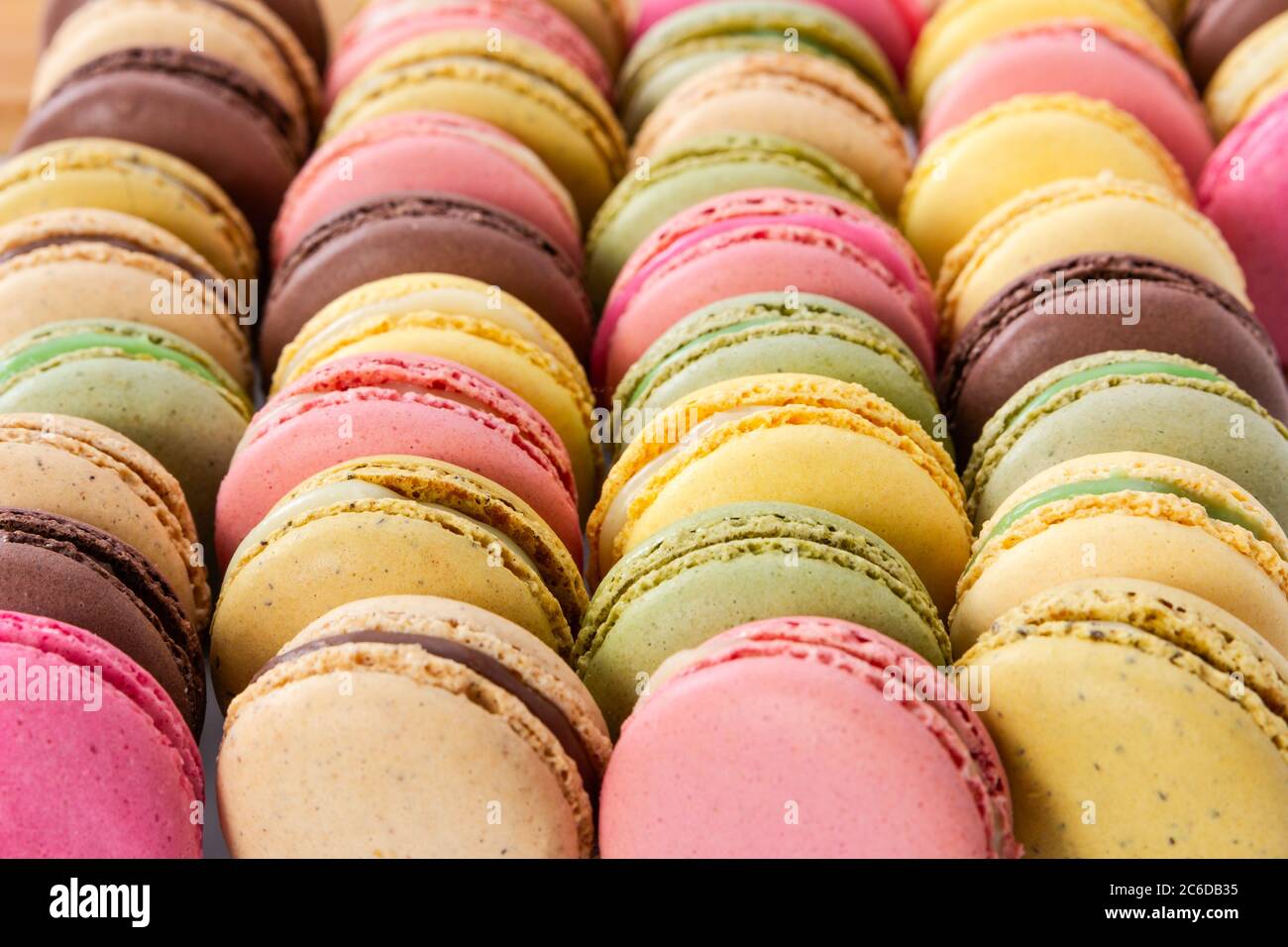 Different colorful french macaroons in a rows. Selective focus Stock ...
