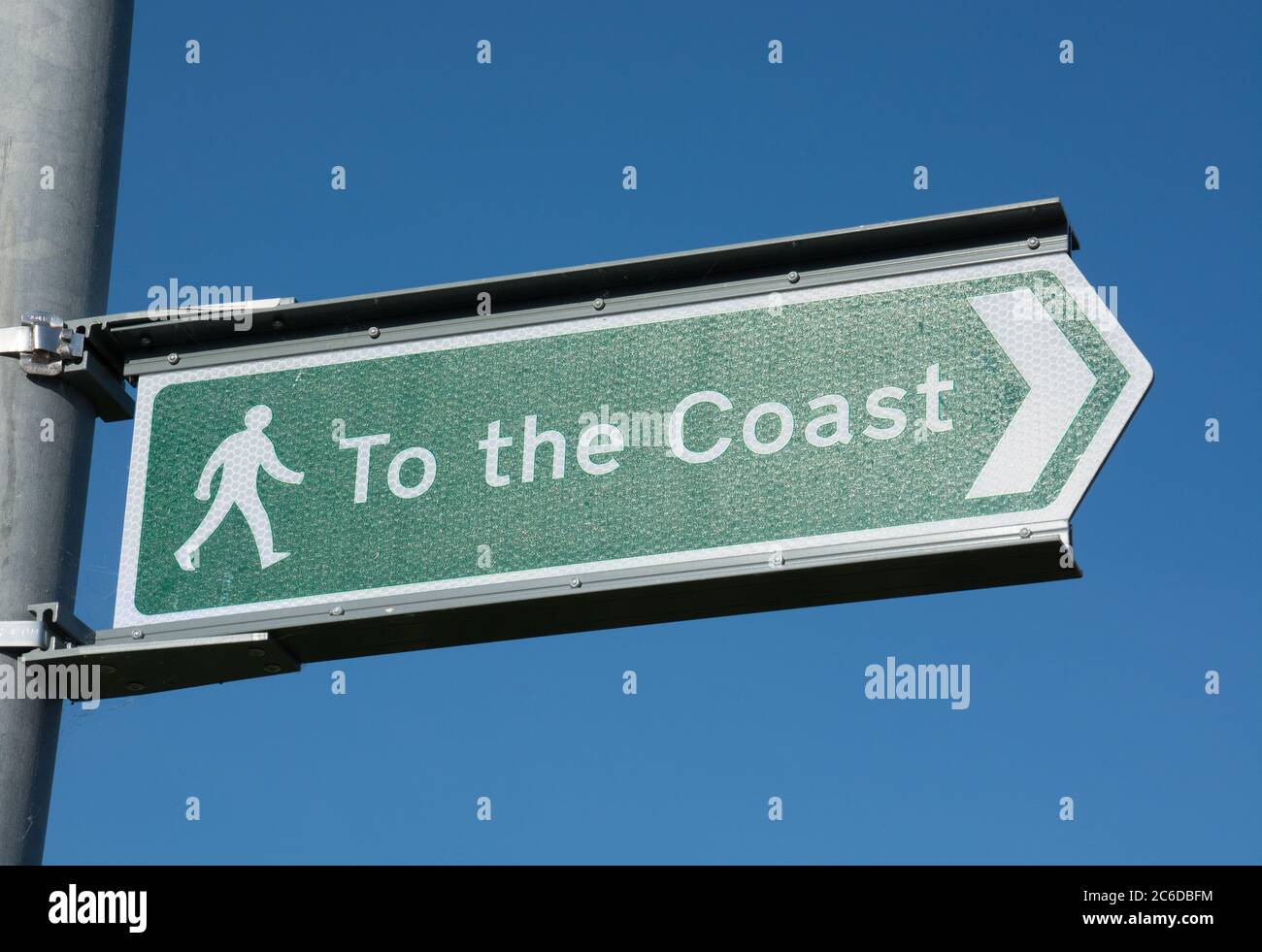 A direction sign for people walking to the coast Stock Photo - Alamy