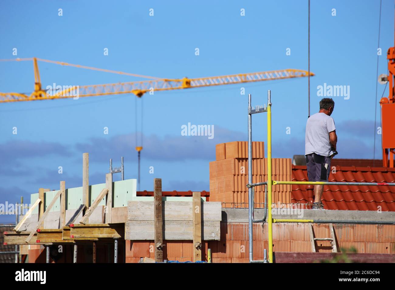 Construction worker (bricklayer) works on the construction site Stock ...