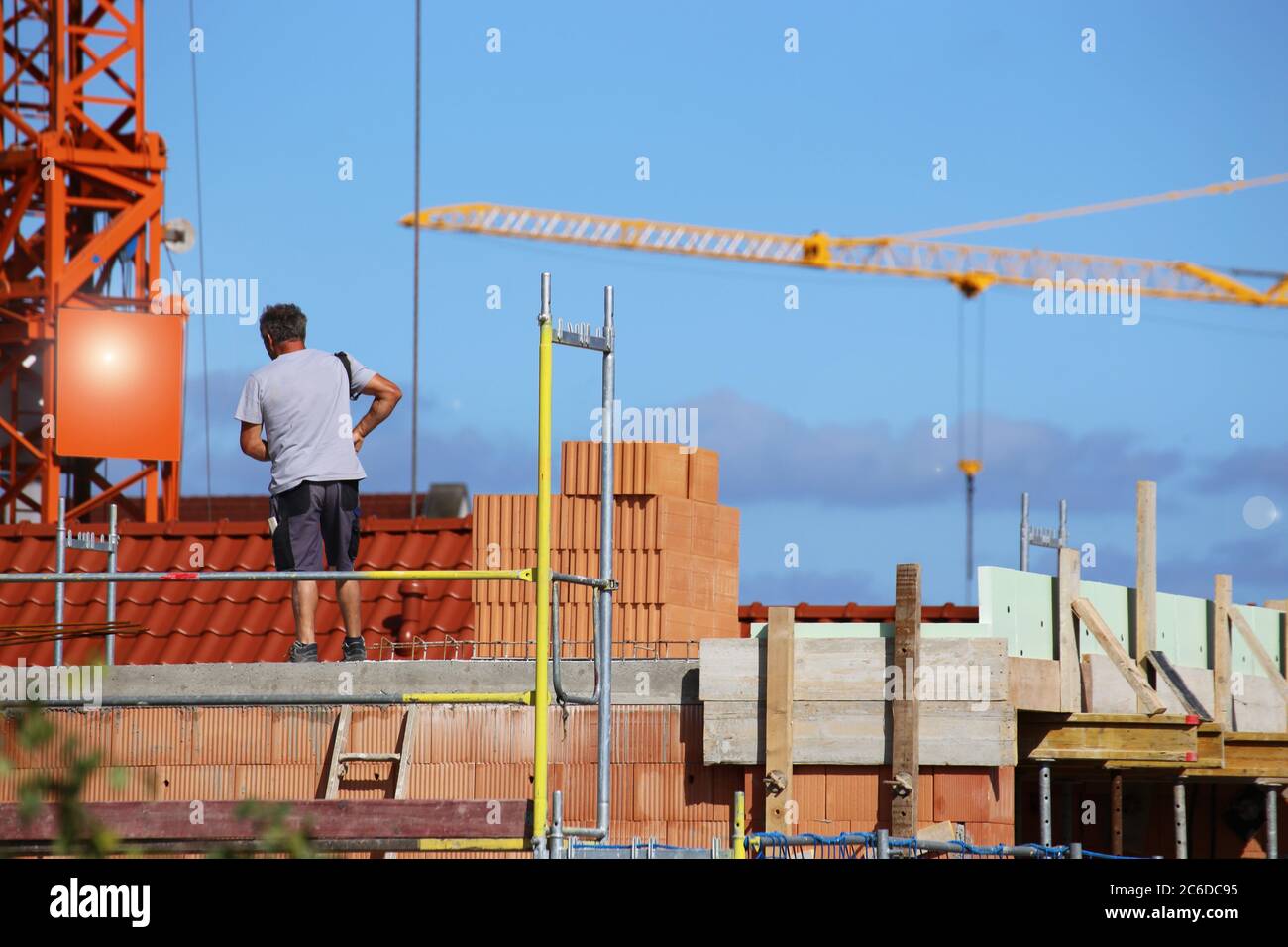 Construction worker (bricklayer) works on the construction site Stock ...