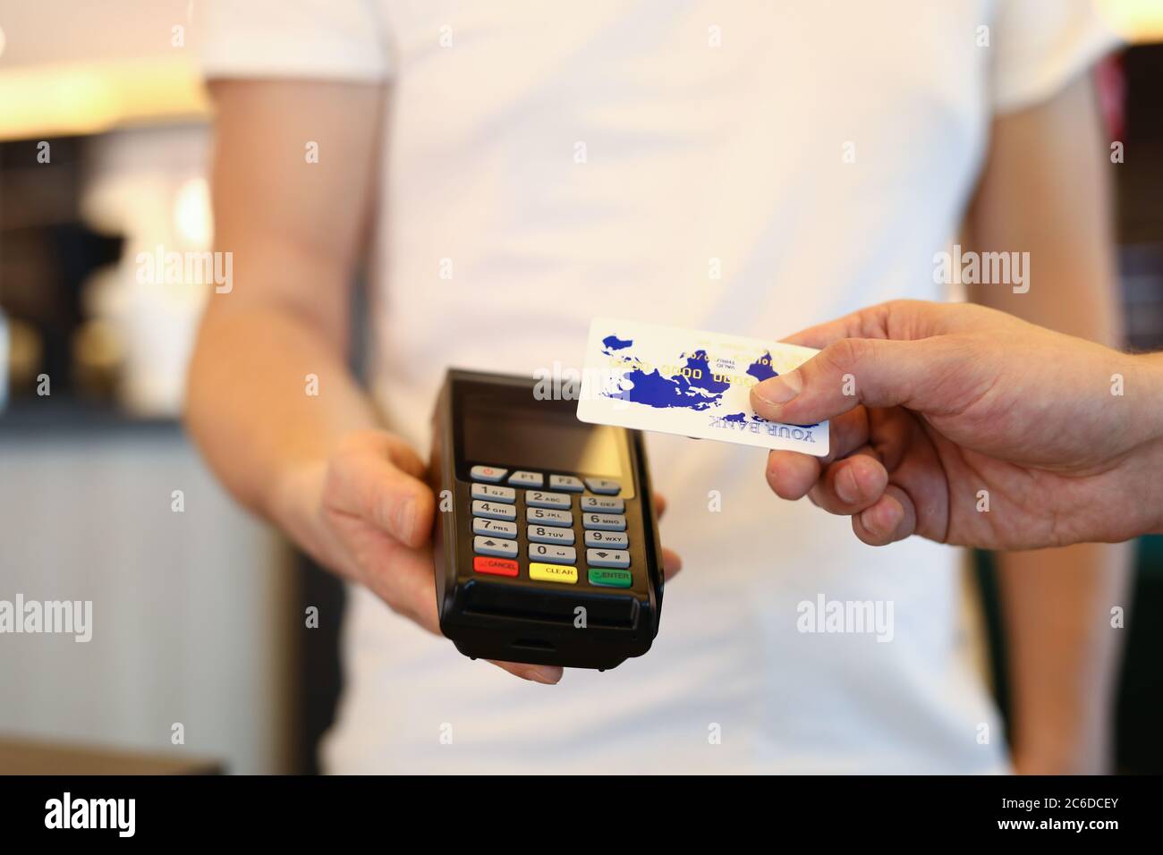 Man applies card to terminal and makes payment Stock Photo - Alamy Man applies card to terminal and makes payment Stock Photo - Alamy