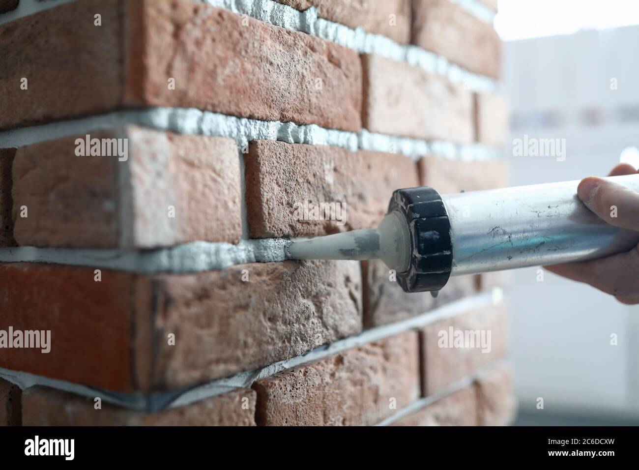 Grouting with tiling fugue Stock Photo - Alamy