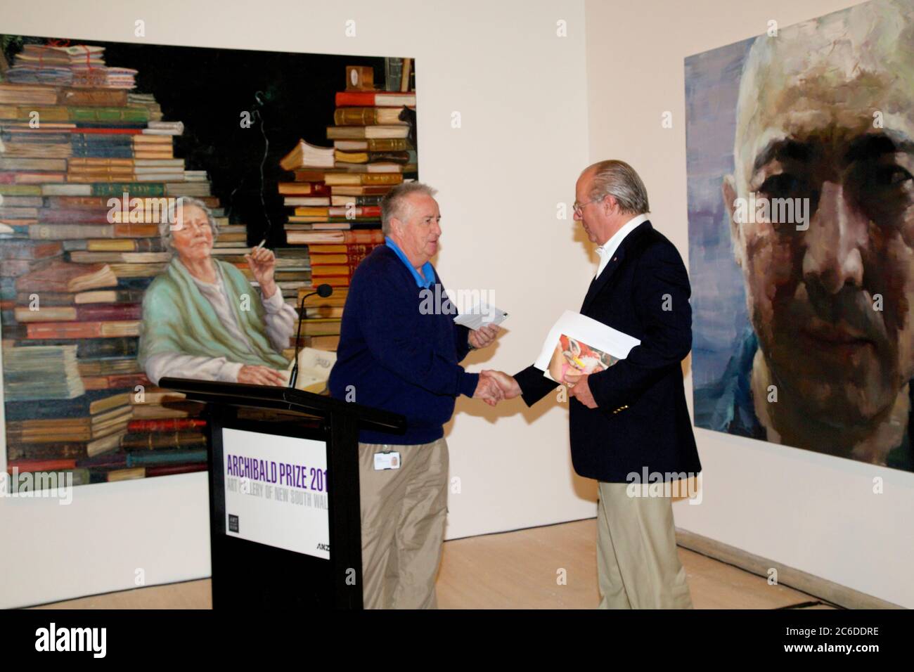 Art Gallery of NSW head storeman Steve Peters (L) presents artist Tim ...