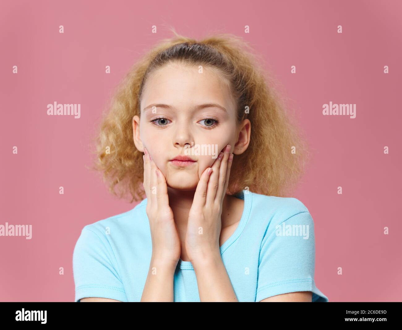 Child girl portrait touch face closeup hi-res stock photography and ...