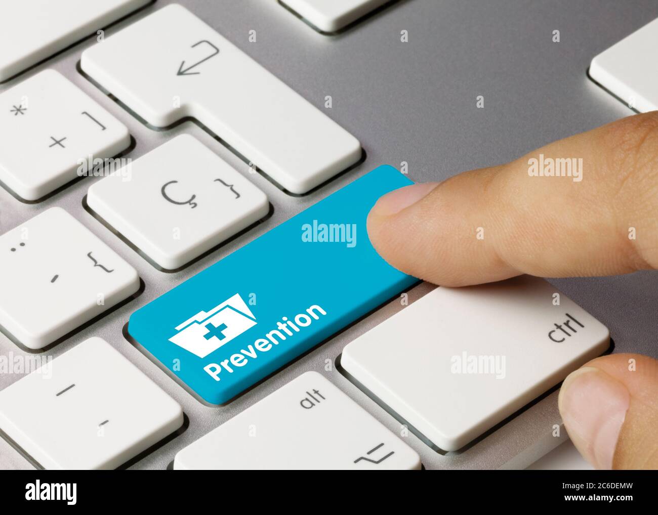 Prevention Written on Blue Key of Metallic Keyboard. Finger pressing ...