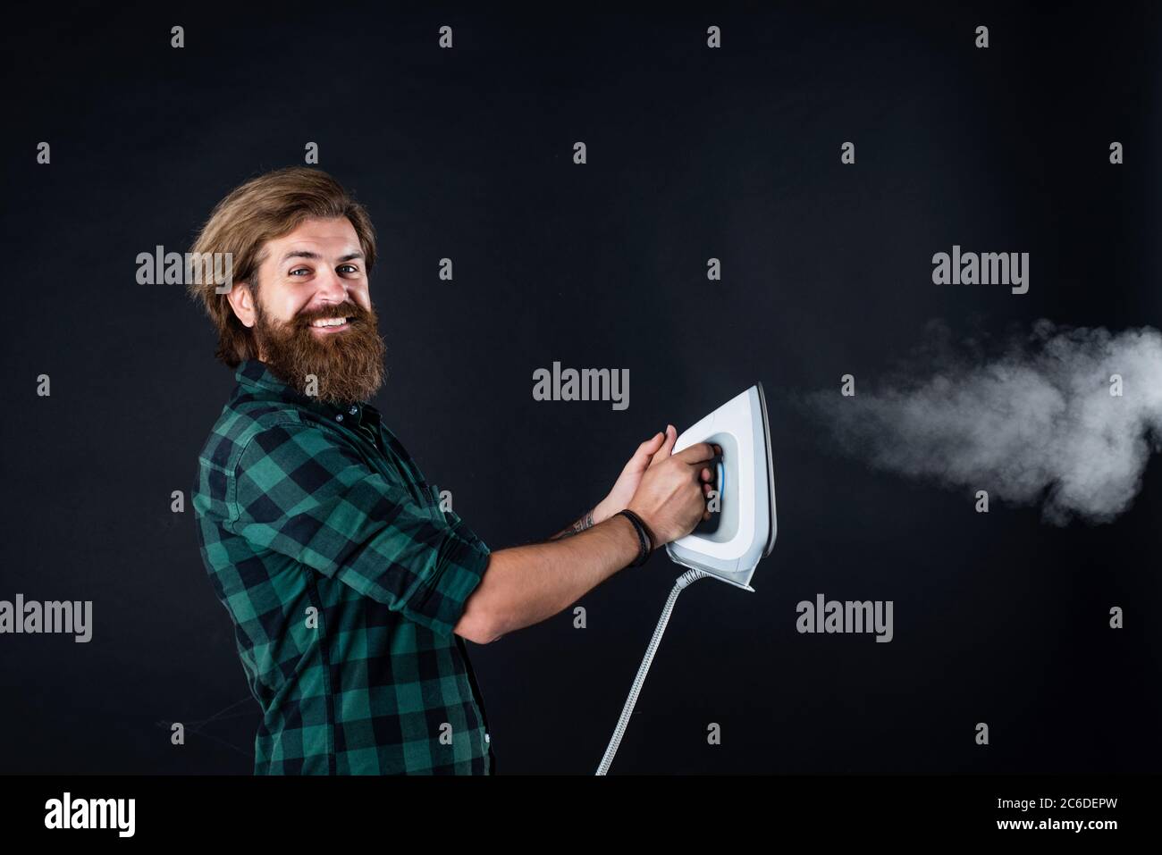 domestic everyday duty. man ironing at home. Happy Man Ironing Clothes ...