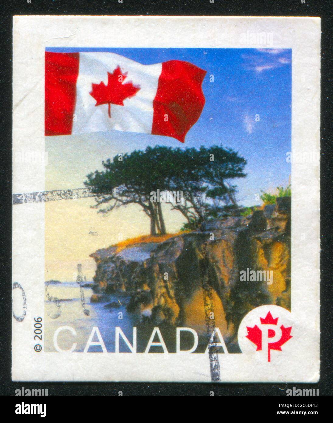 CANADA - CIRCA 2006: stamp printed by Canada, shows Flag and Cliff ...