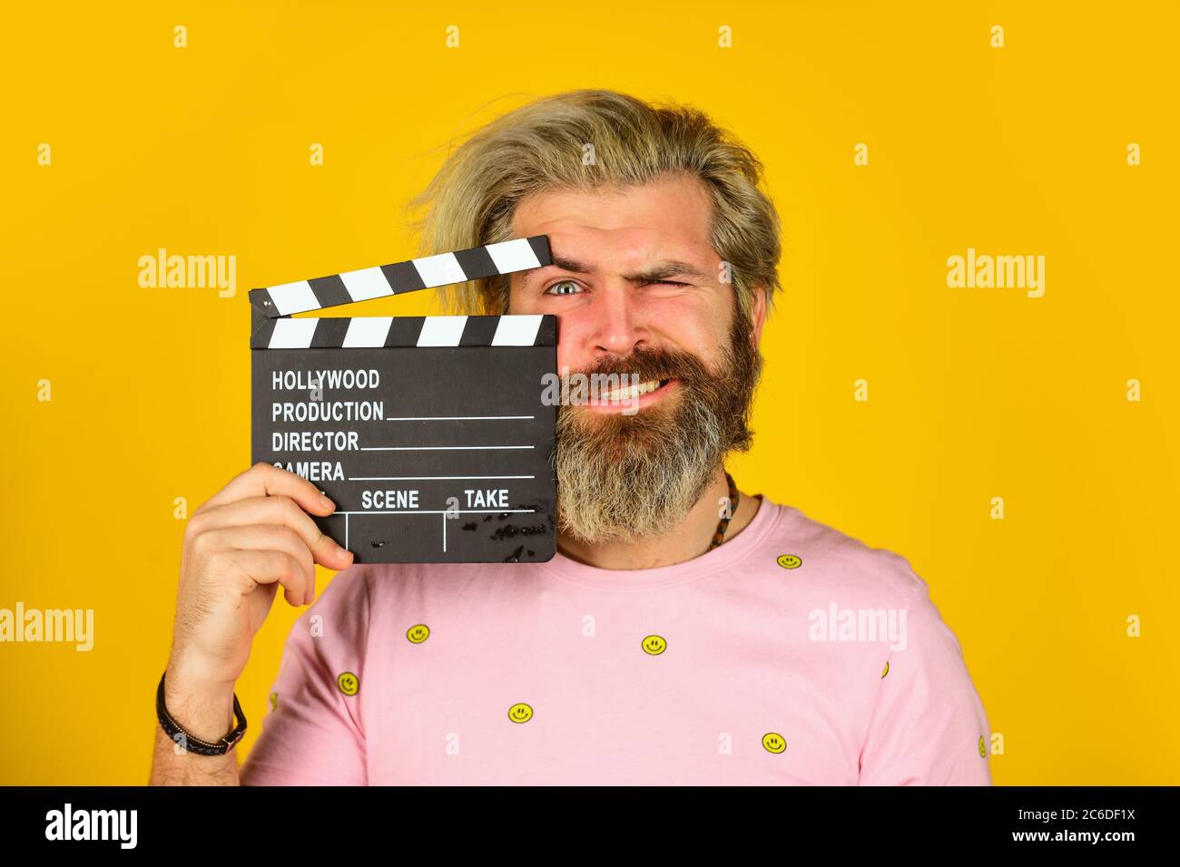 first test in the movie. Man holding film clapper. Professional male ...