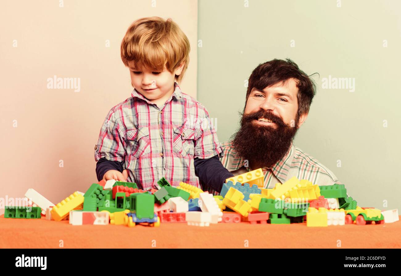 Child care development and upbringing. Father son play game. Bearded ...