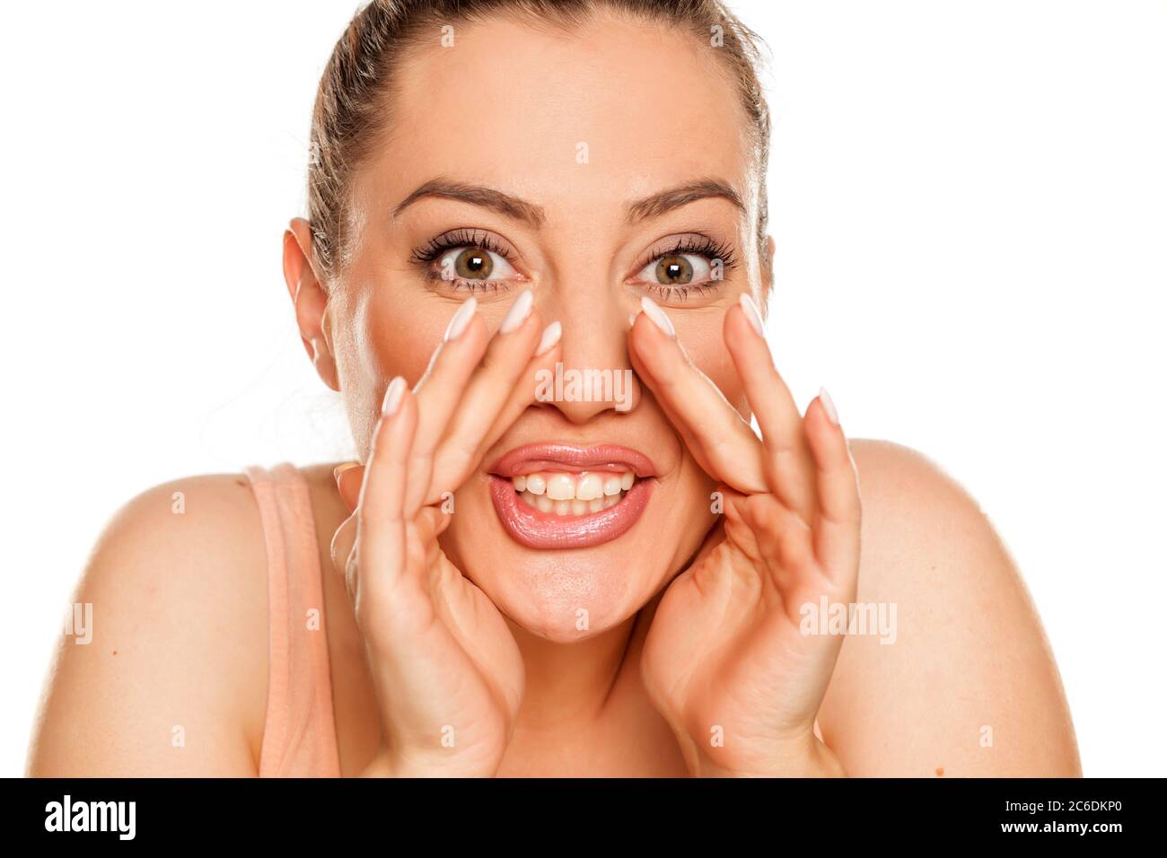 Portrait of beautiful whispering woman on white background Stock Photo ...