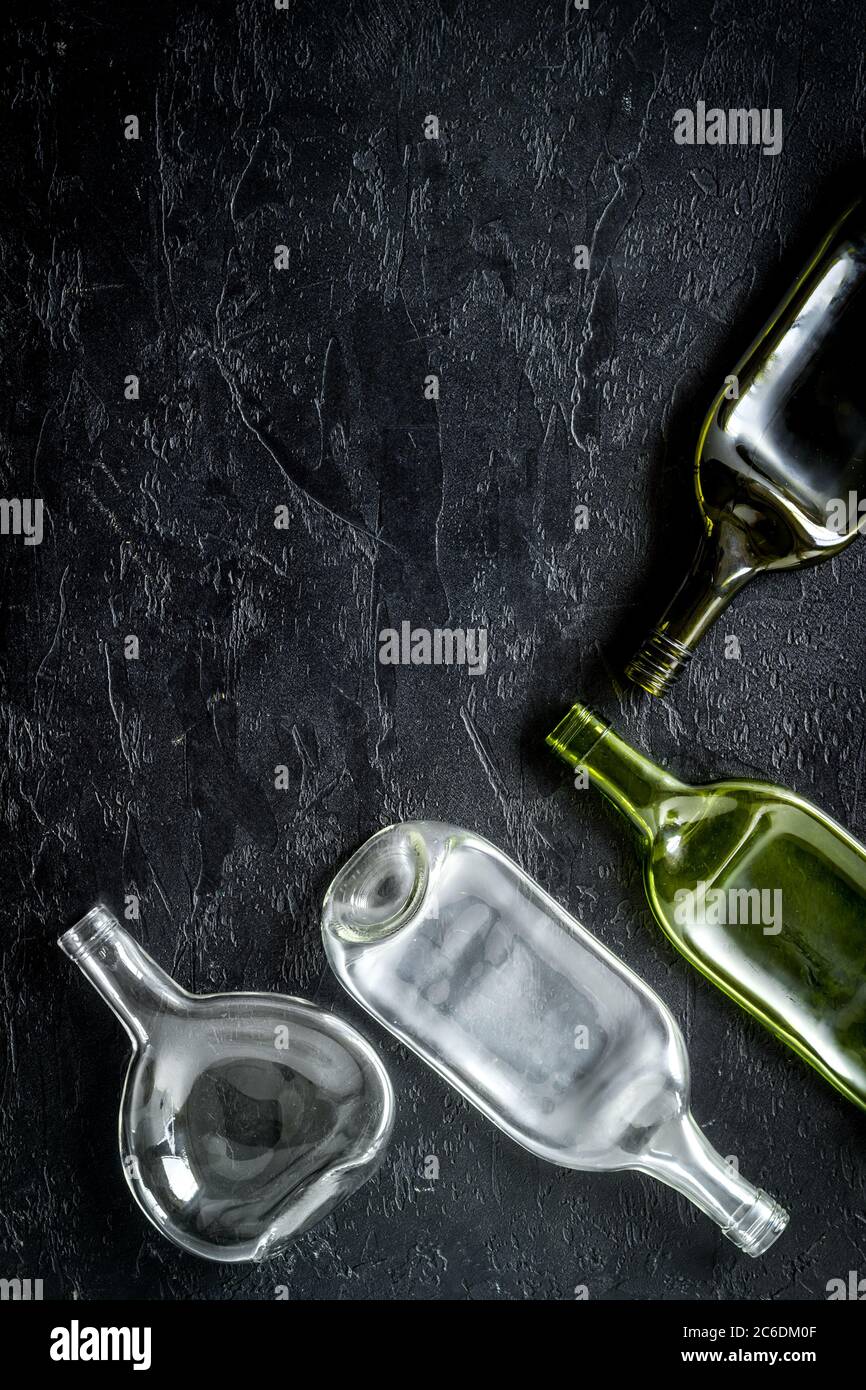 Flat lay with bottles on black table top-down copy space Stock Photo ...