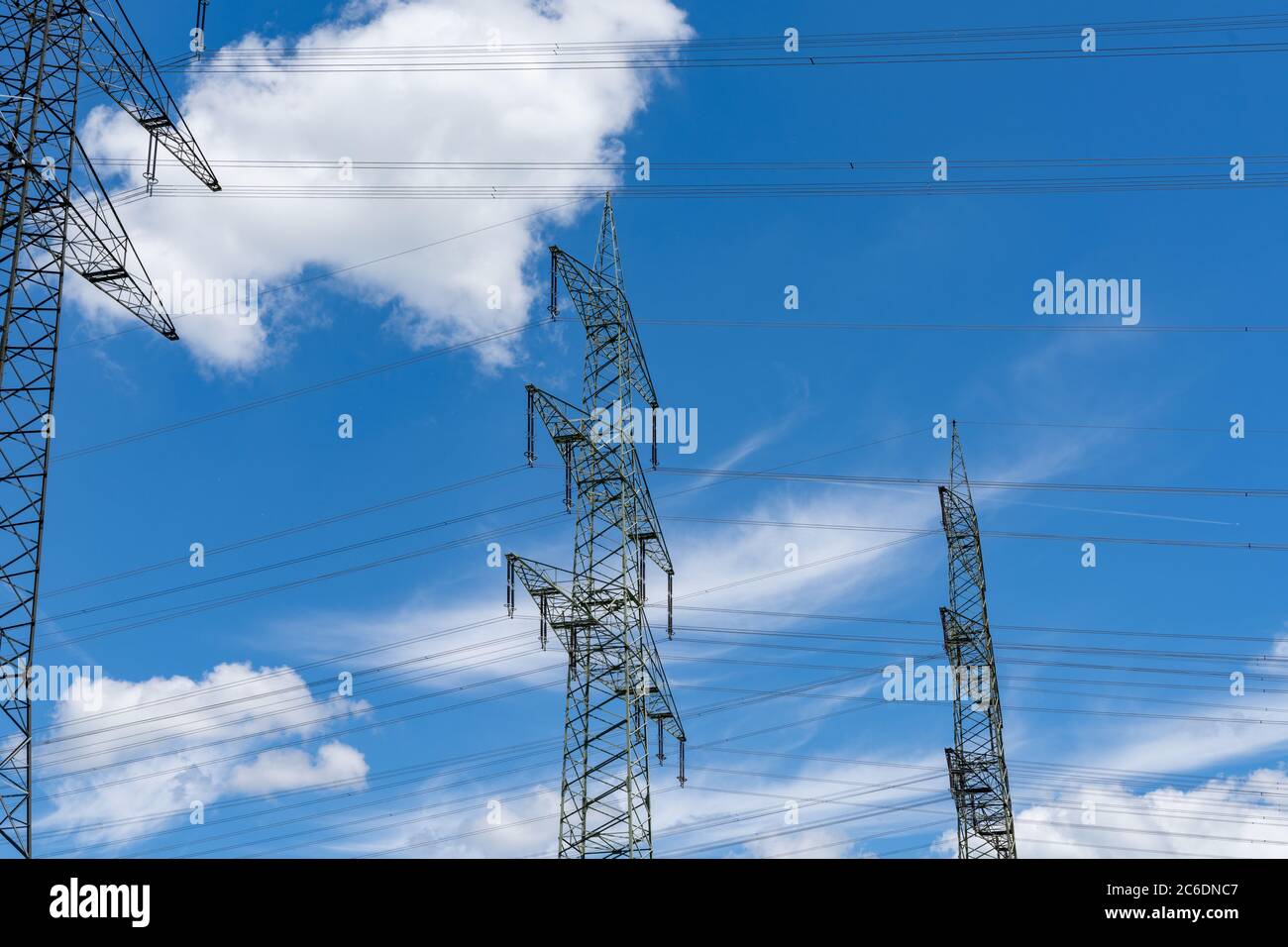 Several large metal high voltage lattice crosses transporting ...
