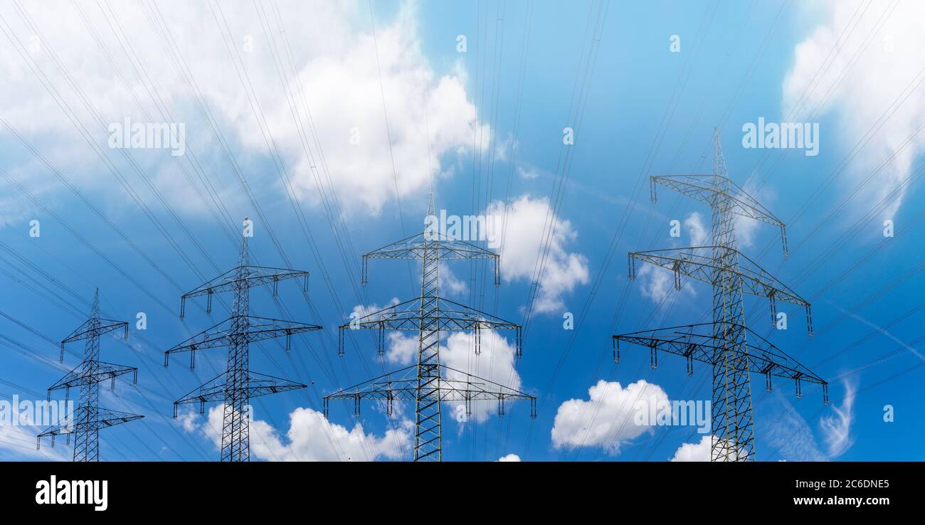 Several large metal high voltage lattice crosses transporting ...