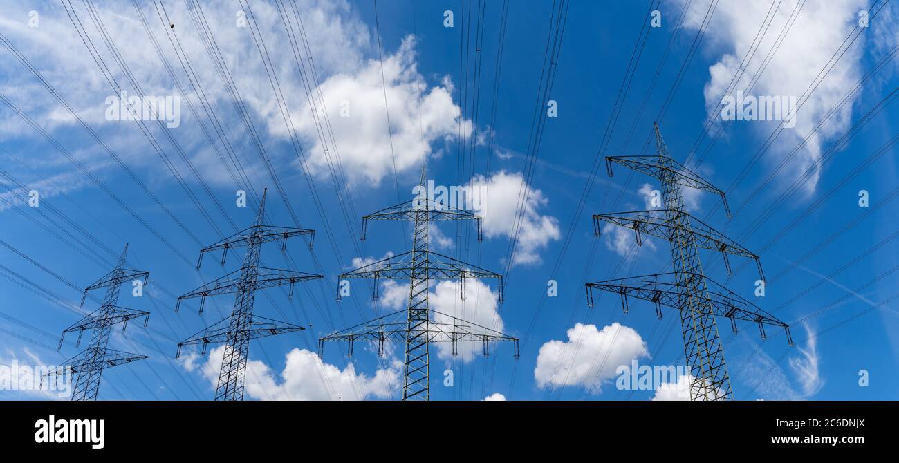Several large metal high voltage lattice crosses transporting ...