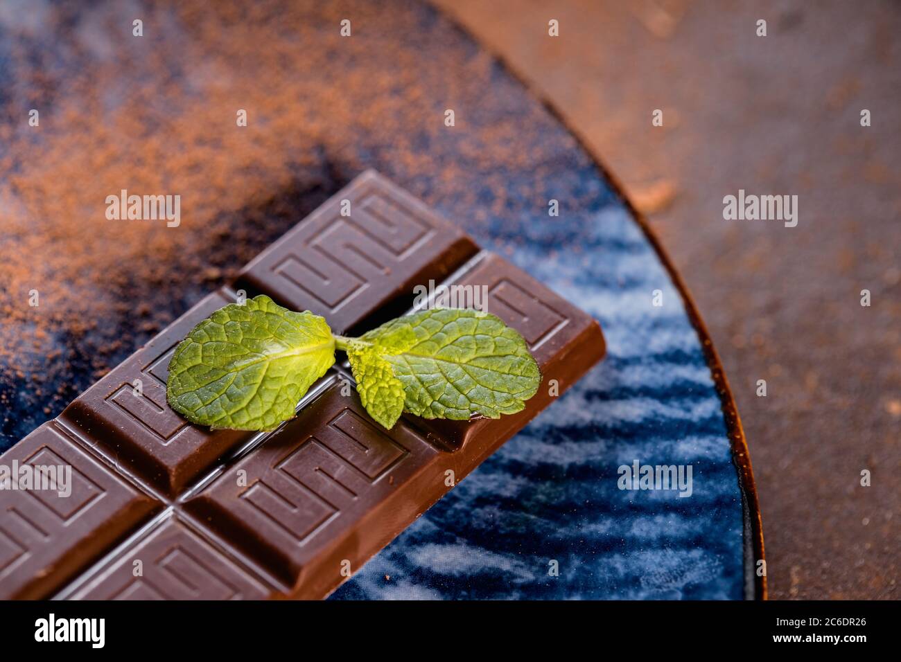Chocolate bar with green mint leaf Stock Photo - Alamy