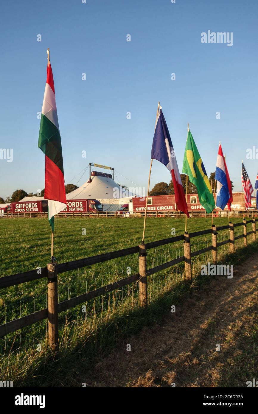Flags of all nations line the approach to Giffords Circus at their ...