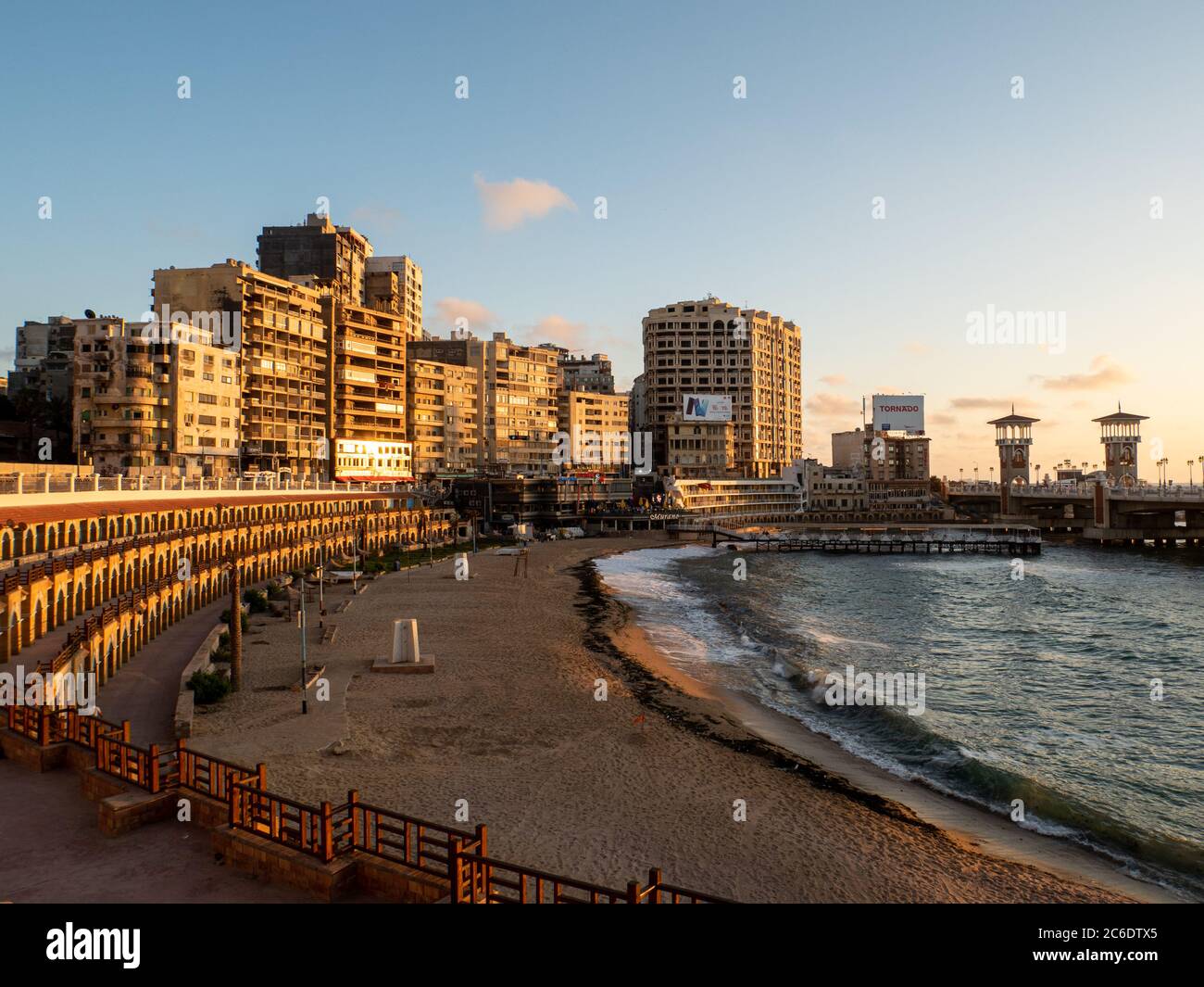 the most famous beach in Alexandria at golden hour - Stanley Beach with ...