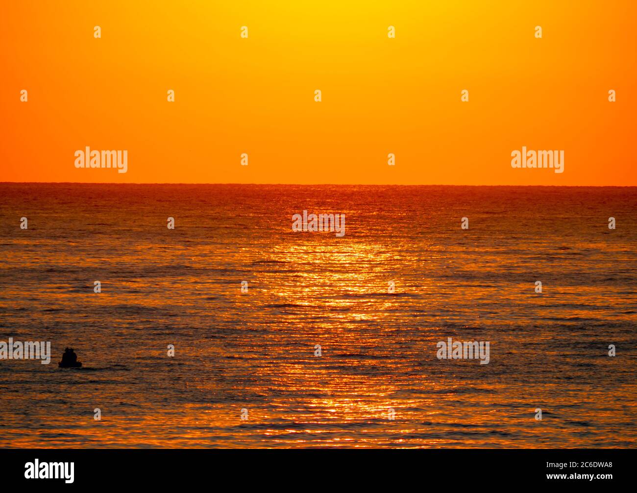 Big sun down over sea hi-res stock photography and images - Alamy