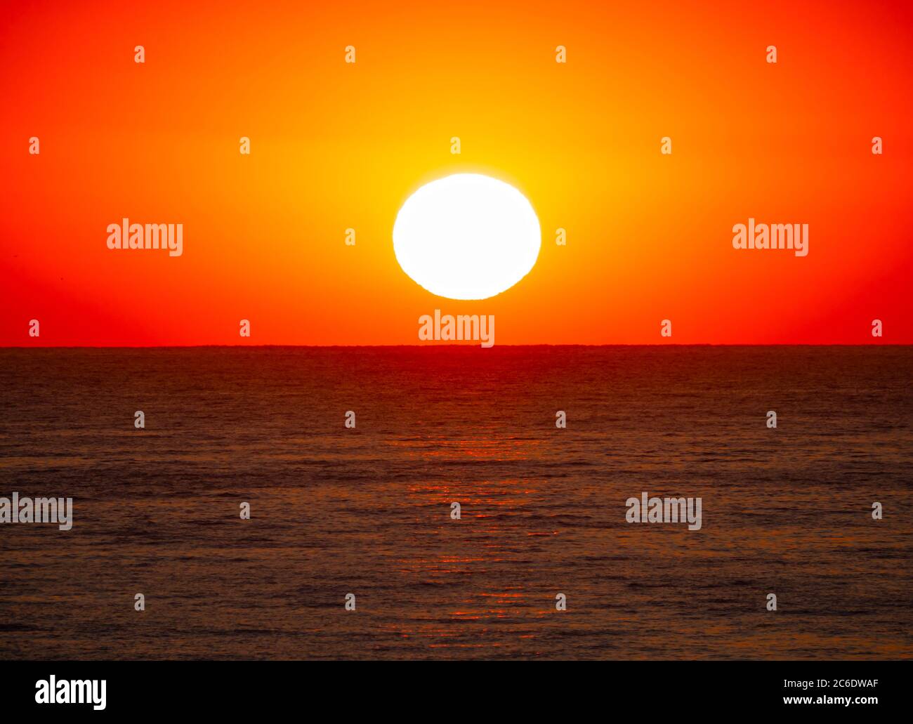 Big sun down over sea hi-res stock photography and images - Alamy