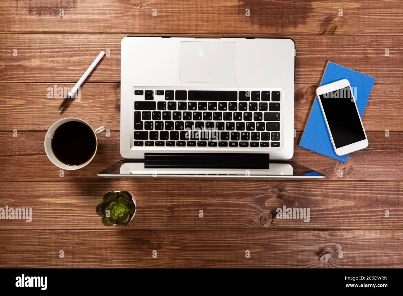 office stuff with notepad, laptop and coffee cup mouse notepad top view ...