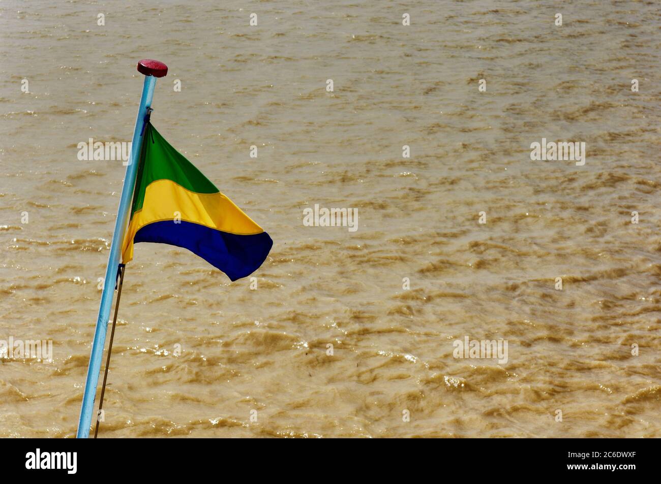 Flag of Inland Water Transport of Myanmar flying on the rear of a ferry ...